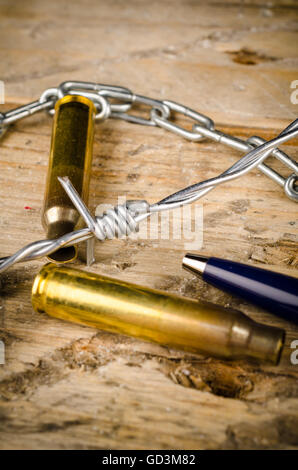 Bullets and barbed wire around a pen, a press freedom concept Stock ...