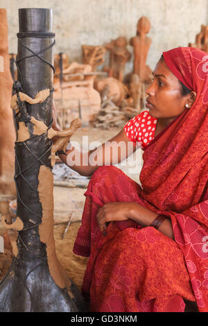Wax model of human figure being covered with clay, bastar, chhattisgarh ...