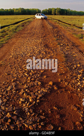 car on muddy road Stock Photo - Alamy