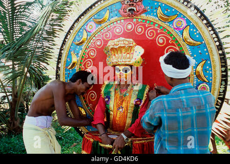 A Theyyam artist performing a ritual dance in a Kerala Temple Stock ...