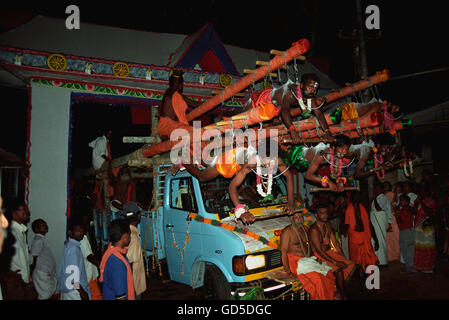 Men suspended by hooks Stock Photo - Alamy