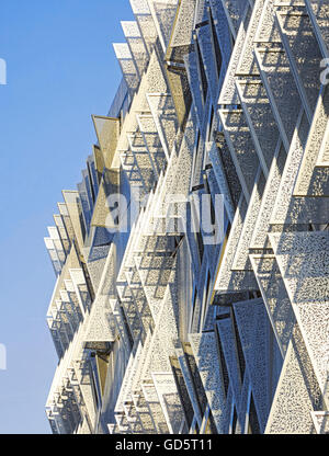 Exterior facade with adjustable triangular perforated steel shutters ...