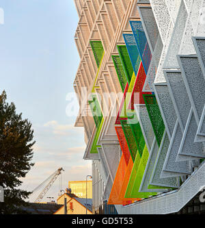 Exterior facade with adjustable triangular perforated steel shutters ...