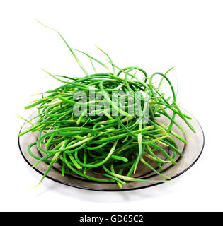Fresh young garlic scapes isolated on white Stock Photo - Alamy