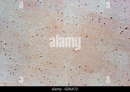 Light-colored sandstone with small holes as wallpaper Stock Photo - Alamy