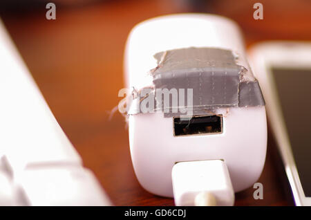 Broken usb cable on a wooden table Stock Photo - Alamy