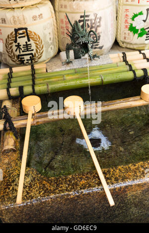 The temizuya, a stone font or basin for ritual cleansing or ablution at ...