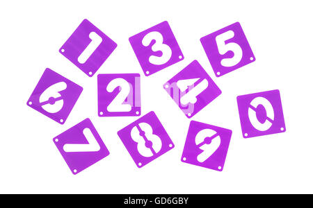 A group of numbers in purple poster board stencils in a messy row ...