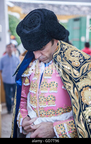 Spainish bullfighter Jose Tomas putting itself the walk cape in the ...