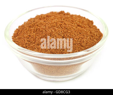 Crushed cumin in a bowl over white background Stock Photo - Alamy