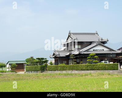 Traditional Japanese ornate wooden roof overhang with gold decoration ...
