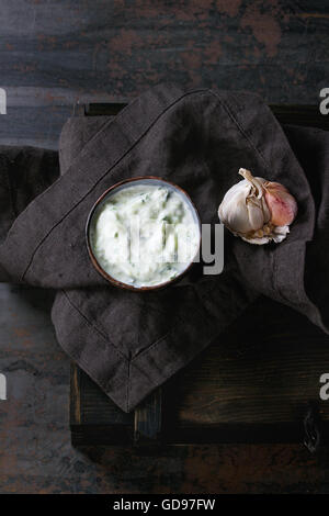 Traditional greek dip sauce or dressing tzatziki prepared with grated ...