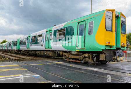 Southern Rail Coastway Class 313 locomotive and train on a level ...