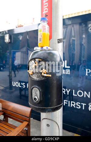 Cigarette disposal bin in smoking zone Stock Photo - Alamy