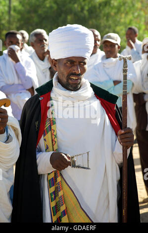 Ethiopian priest with cane and sistrum. Palm Sunday Christian religious ...