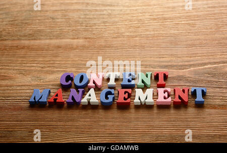 CONTENT - words made from multicolored letters on wooden background ...