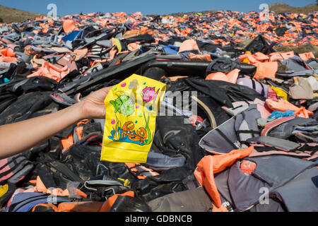 life jackets used by refugees to cross from Turkey to Greece. They are ...
