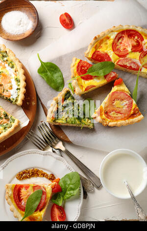 Homemade quiche with red fish, salmon, broccoli and cheese on wooden ...