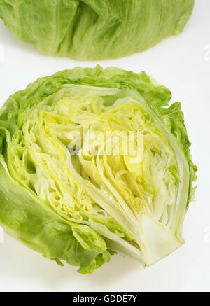 A vertical shot of a salad with iceberg lettuce cherry tomatoes and on ...