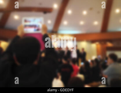 Blurred background of man recording video or taking picture by ...