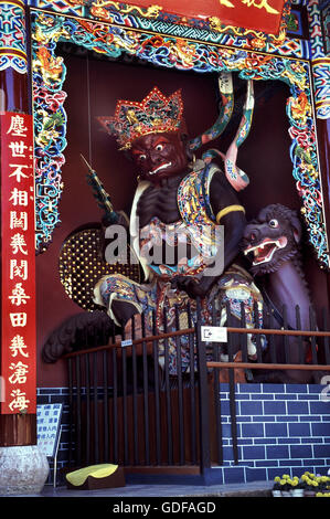A ferocious god at the entrance to the Huatang Temple near Kunming in ...