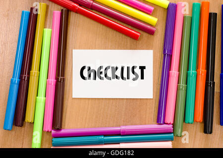 Checklist written on whiteboard over wooden background Stock Photo - Alamy
