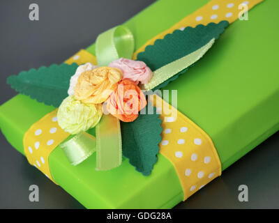 Gift box tied with beautiful green ribbon on white background Stock ...