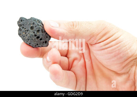 volcanic lava in hand isolated on a white background Stock Photo - Alamy