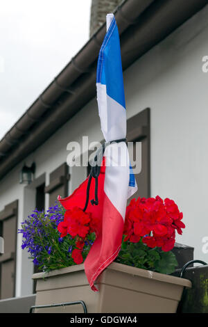 France and the French in mourning as the blue white and red flag at ...