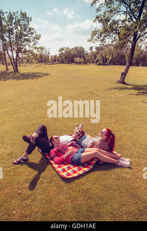 Best friends resting in park Stock Photo - Alamy