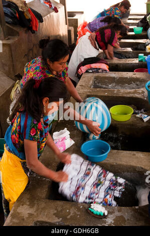 Maya indigenous women wash laundry at the Public Pila of Antigua ...