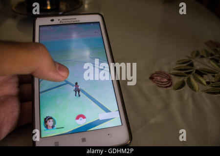 Egypt. 17th July, 2016. An Egyptian man holding his mobile phone and ...