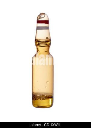 A closeup shot of a small glass vial in the hand with dry flowers ...