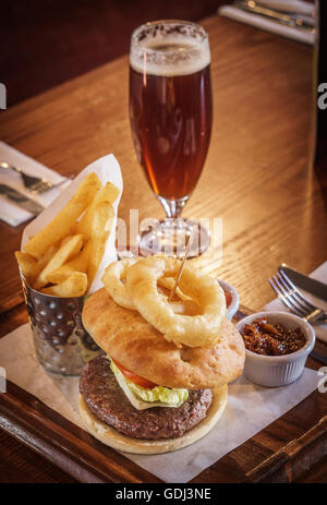 Fresh Scottish burger with onion rings and garnish Stock Photo - Alamy