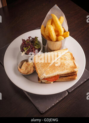 Cheese, ham and tomato toastie, served with chips and salad Stock Photo ...