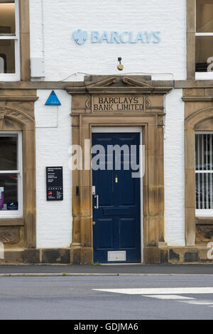 Opening hours sign by the entrance to a Barclays Bank Stock Photo - Alamy