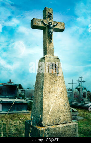 Stone cross with crucified Jesus Christ Stock Photo - Alamy