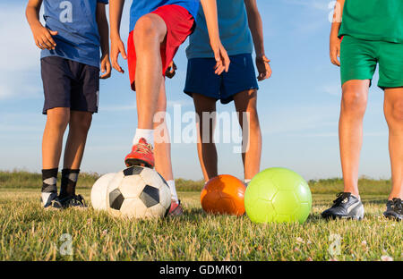 Young boys playing football Stock Photo - Alamy
