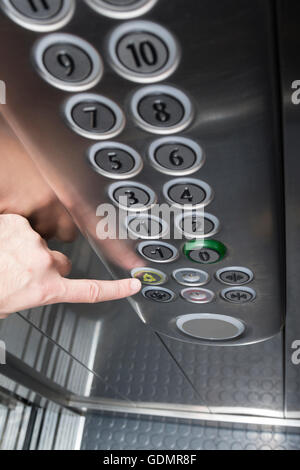 Businessman pressing SOS button in the case of danger Stock Photo - Alamy