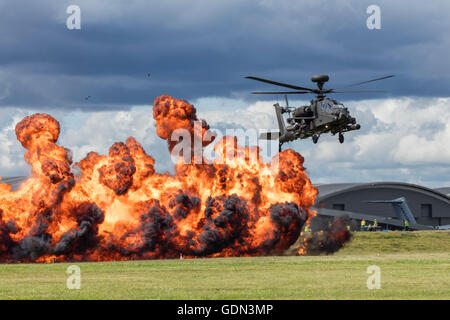 British Army Apache Helicopter fires missile to cause explosion. Photo ...