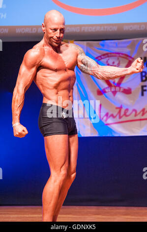 Male bodybuilder Erik Stobbe shows his best front double biceps pose ...