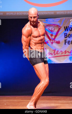 Male bodybuilder Erik Stobbe shows his best front double biceps pose ...