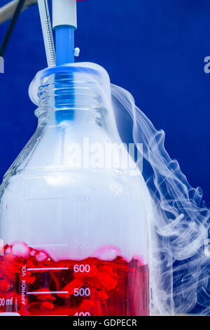 Different laboratory glassware with color liquid on laboratory ...