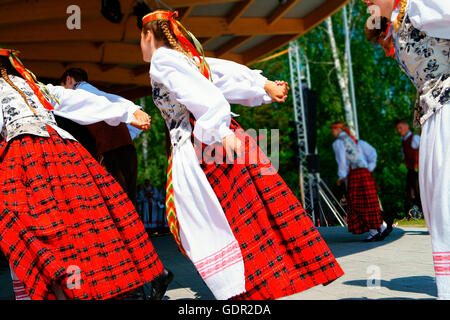 Young people playing lithuanian traditional dances at a local folk ...