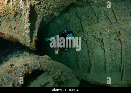 Female scuba diver inside the wreck of the SS Dunraven, Red Sea, Egypt ...