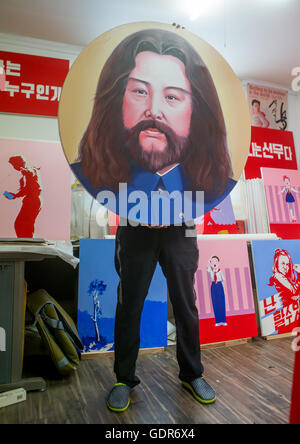 Sun mu artist hiding behind one of his painting, National capital area ...