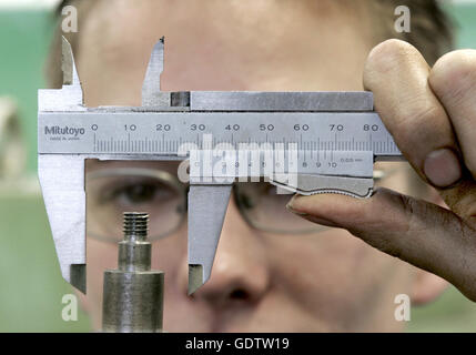 Apprentice with vernier caliper Stock Photo - Alamy