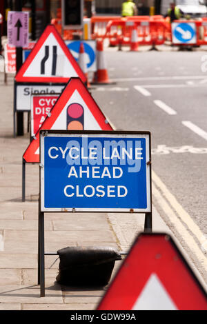 bike lane or red road with signs of bicycles Stock Photo - Alamy
