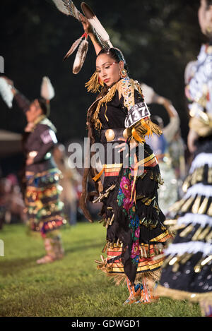 Indigenous woman performing jingle dance during Canada Day powwow in ...