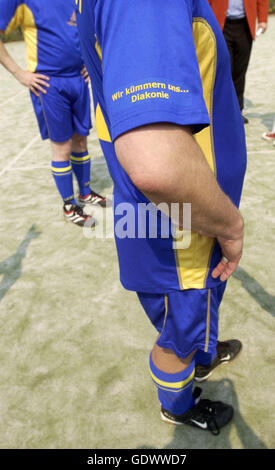 Imams and priests playing football Stock Photo - Alamy